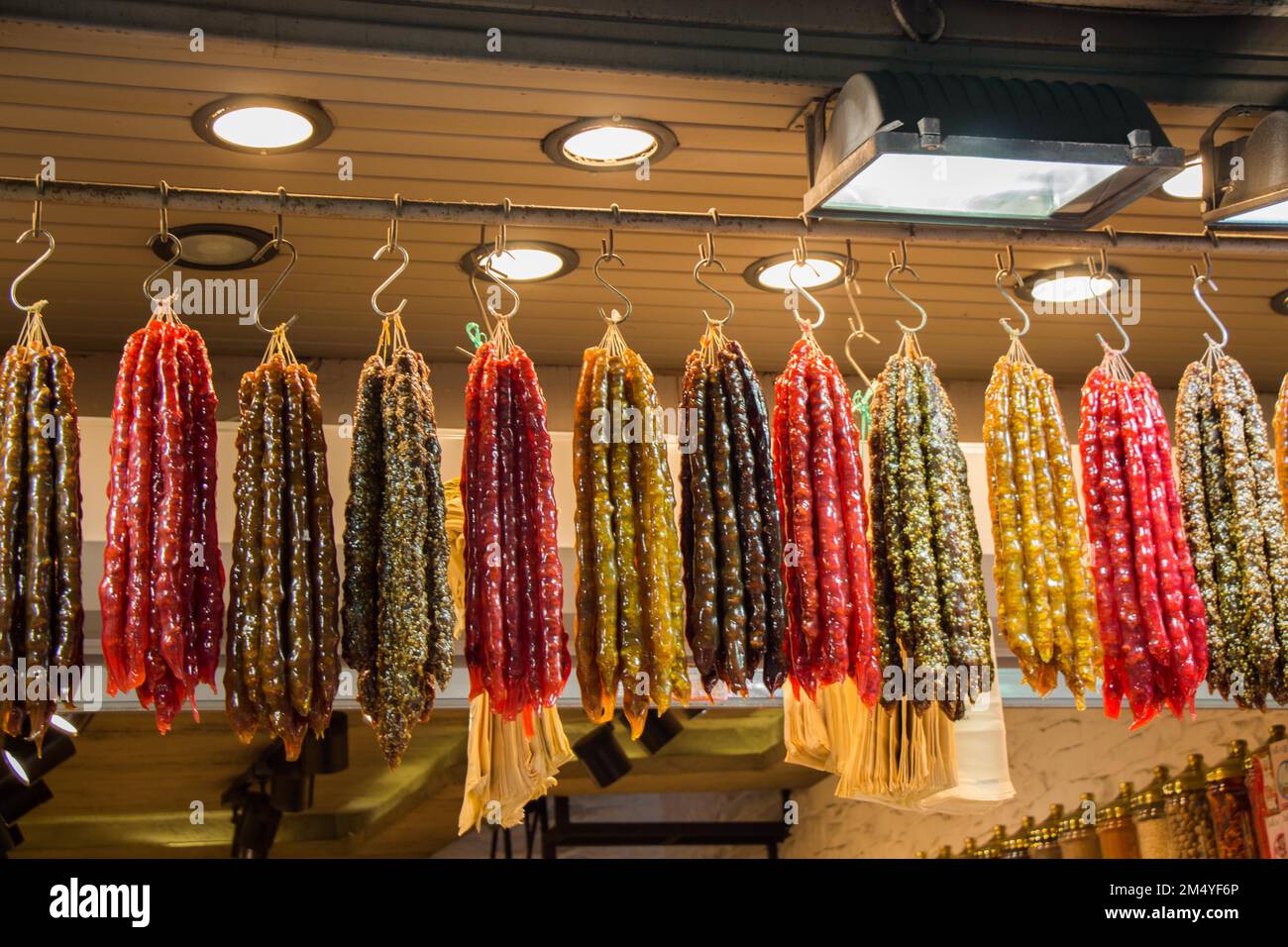 Traditional sausage-shaped candies with walnut in it Stock Photo - Alamy