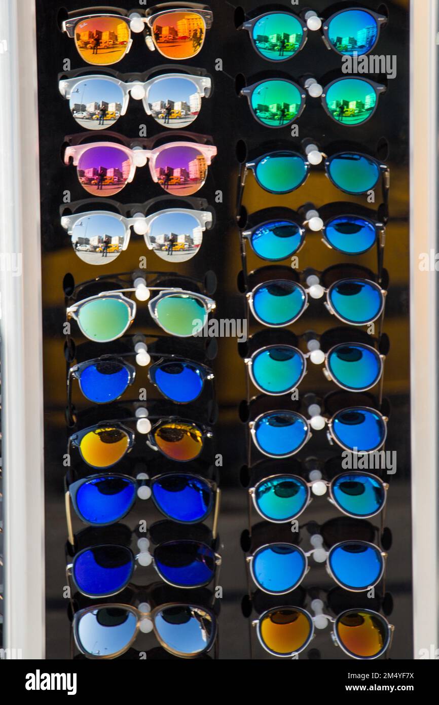 Set of different colored glasses as a background Stock Photo - Alamy