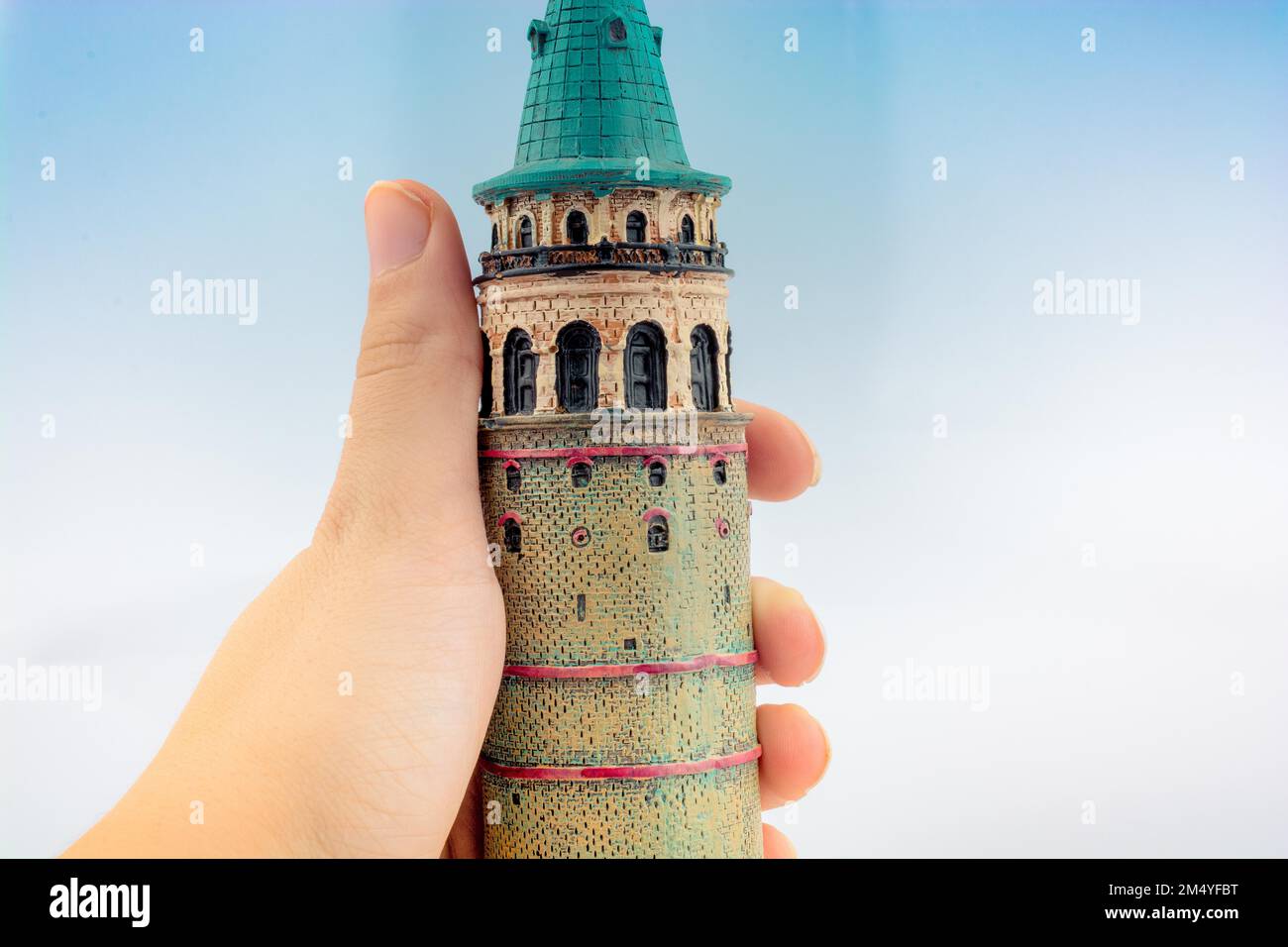 Hand holding a model of the Galata Tower in Istanbul Stock Photo - Alamy
