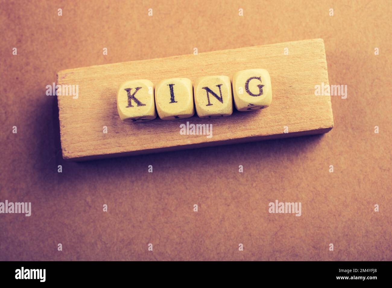 King wording with wooden cubes on a piece of wood Stock Photo - Alamy