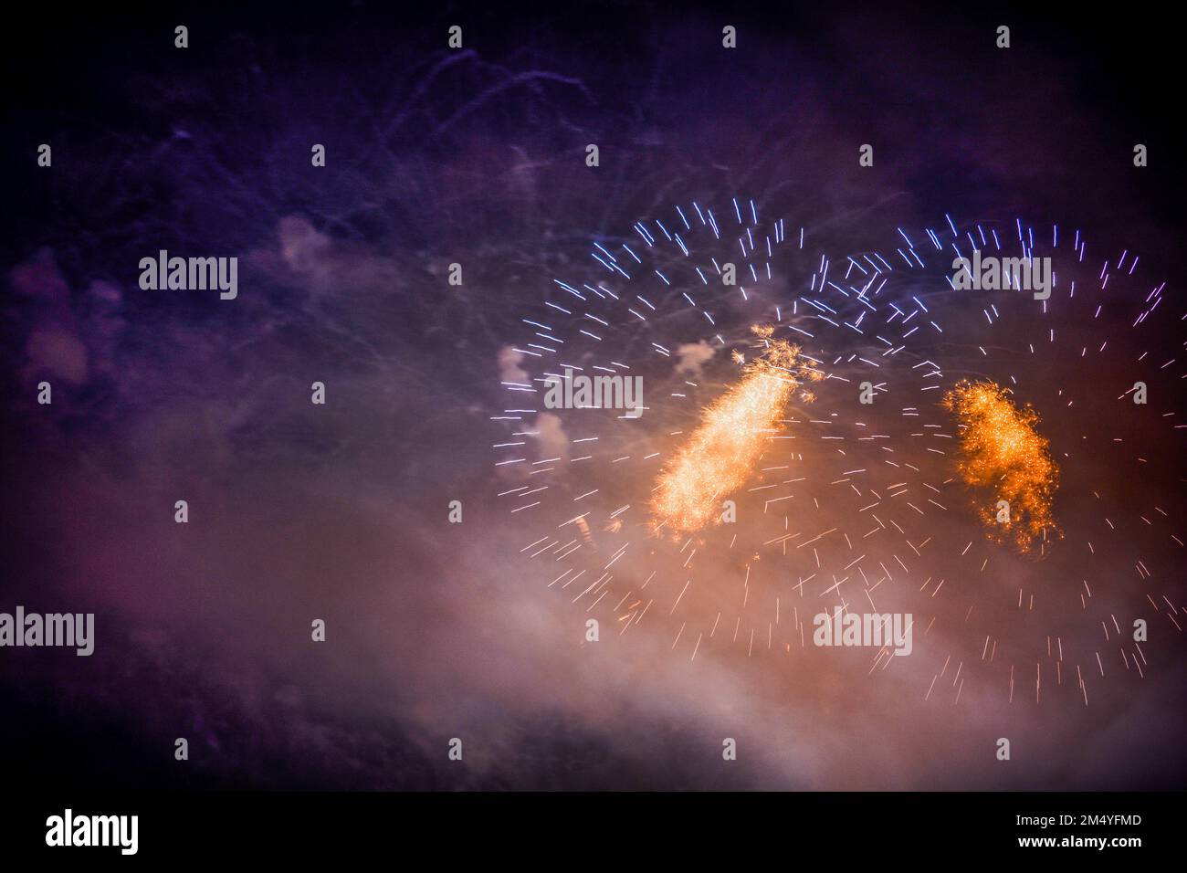 Festive colour firework background at a dark night Stock Photo - Alamy