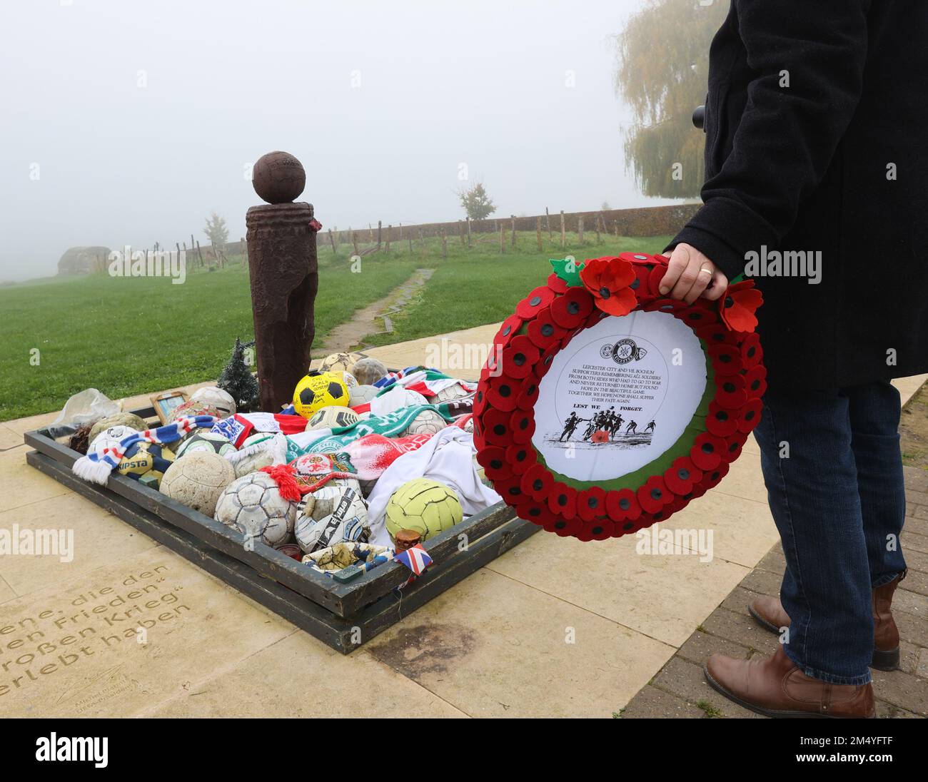 A wreath of poppies is laid at the memorial commemorating a football ...