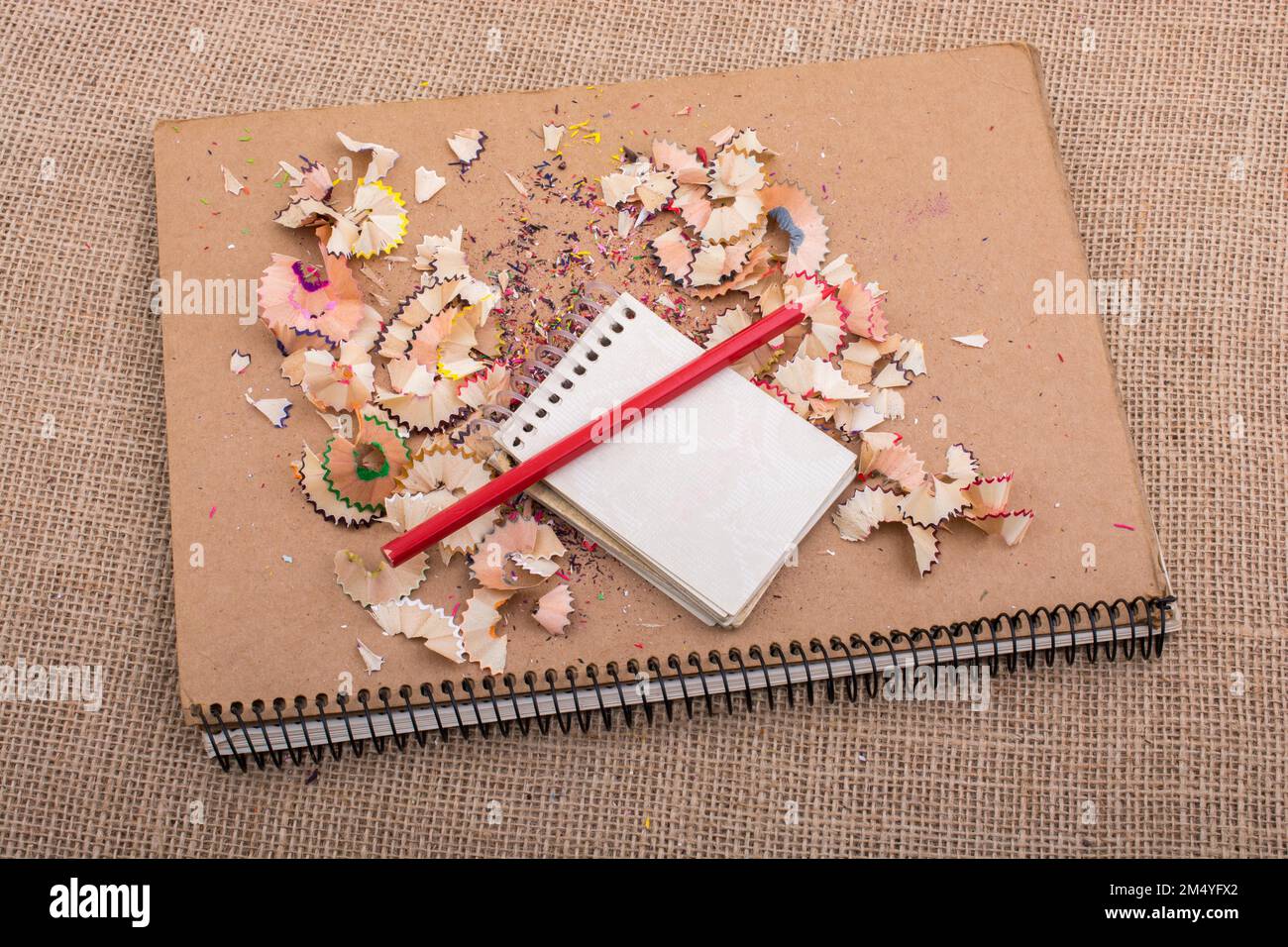Color pencil on spiral notebooks with pencil trash Stock Photo - Alamy