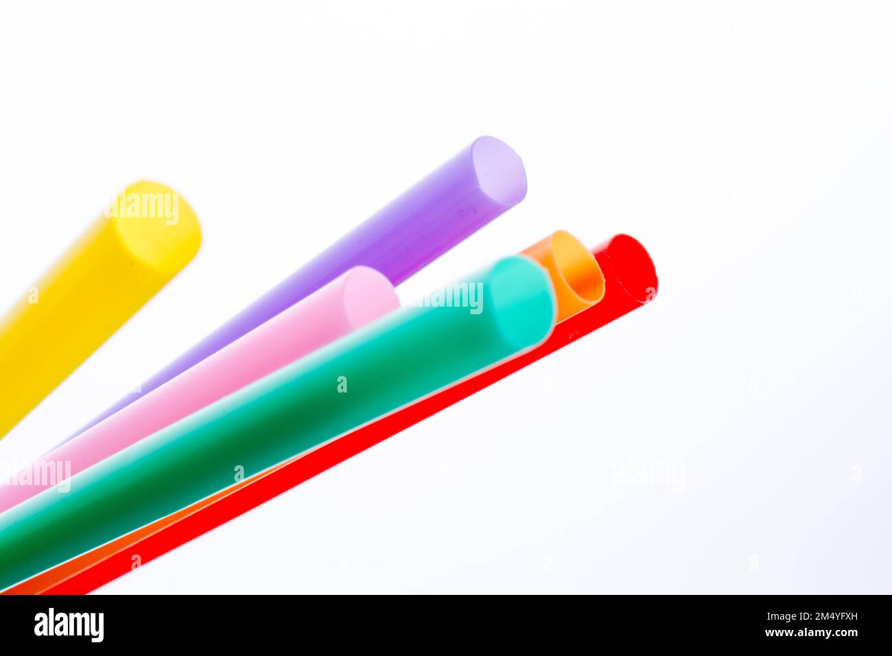 Different color of straw on a white background Stock Photo - Alamy