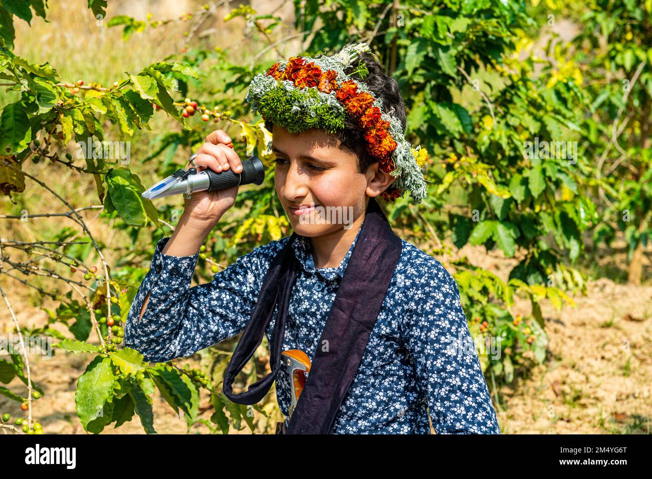 Young boy of the Qahtani Flower men tribe in the coffee plants, Asir ...