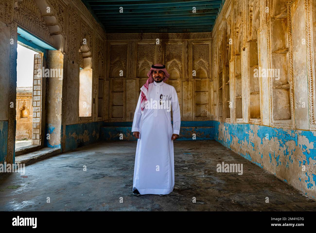 Man standing in a beautiful old merchant house, Farasan islands ...