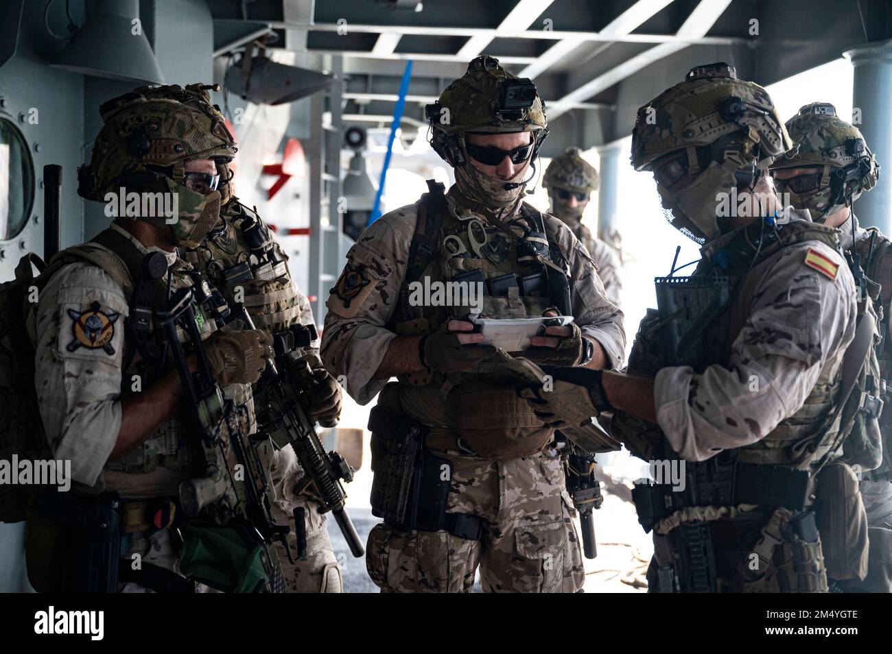 Spanish Special Operation Maritime Team Unit (SOMTU) sailors discuss ...
