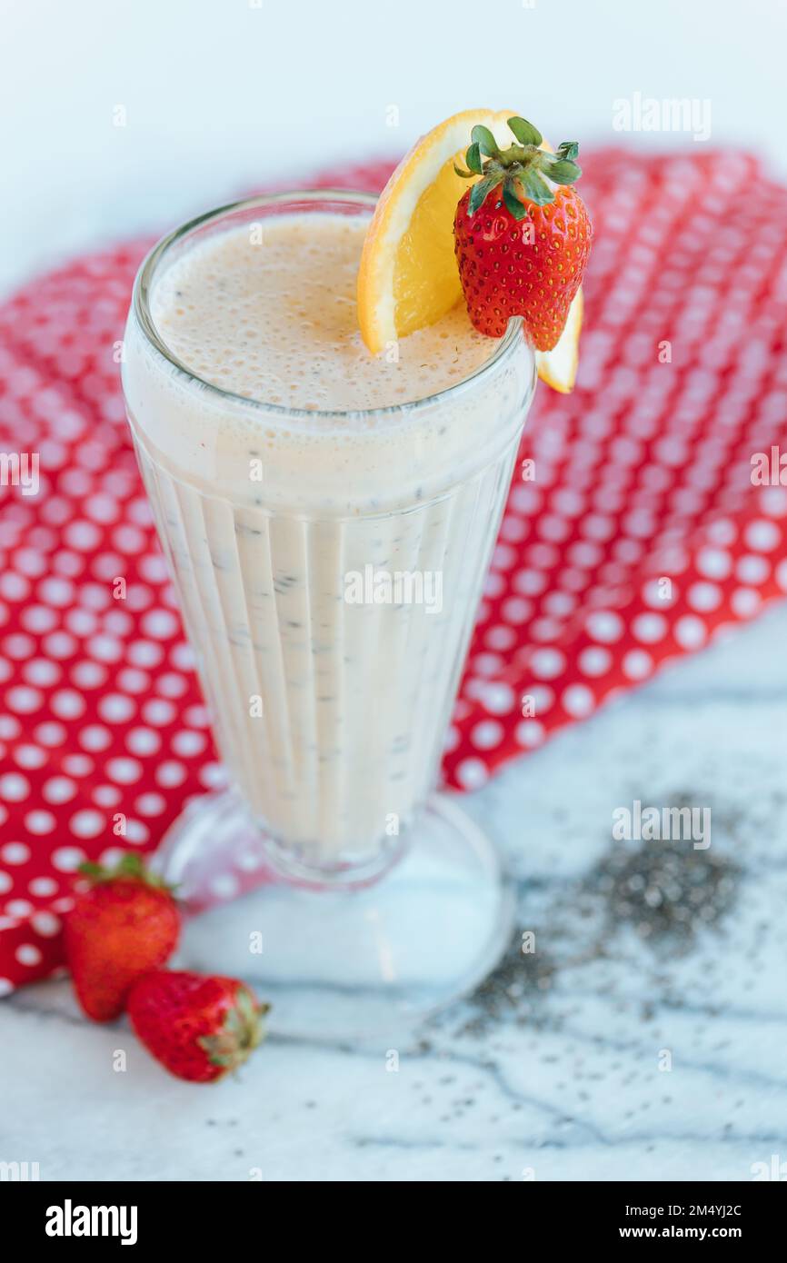 A vertical shot of a strawberry milkshake on the white background Stock ...