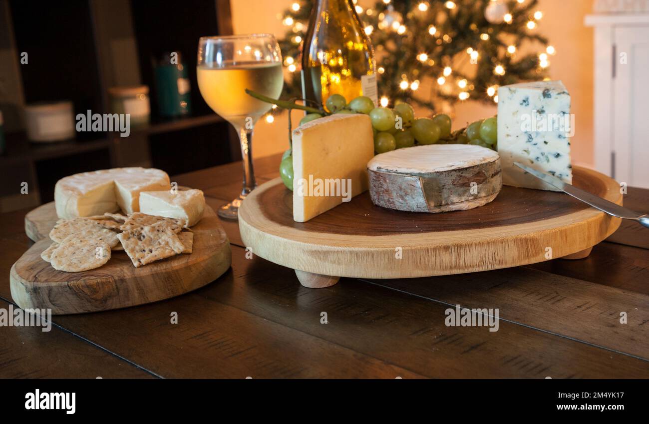 Cheese plate and wine including chardonnay, gourmet crackers, a washed ...