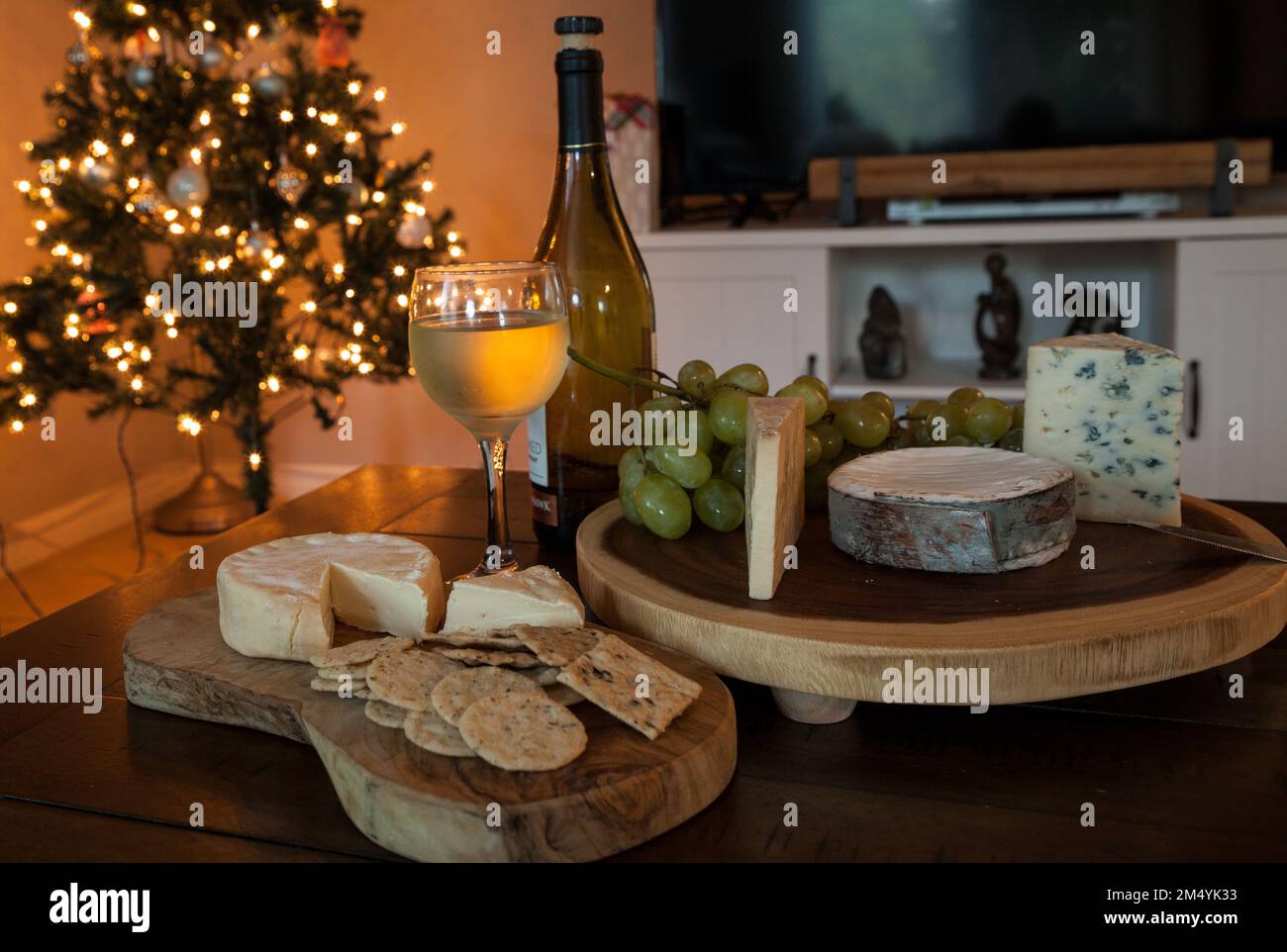 Cheese plate and wine including chardonnay, gourmet crackers, a washed ...