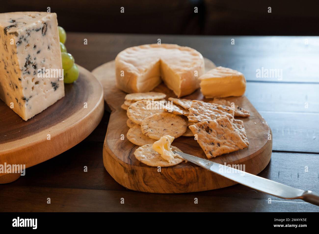 Cheese plate and wine including chardonnay, gourmet crackers, a washed ...