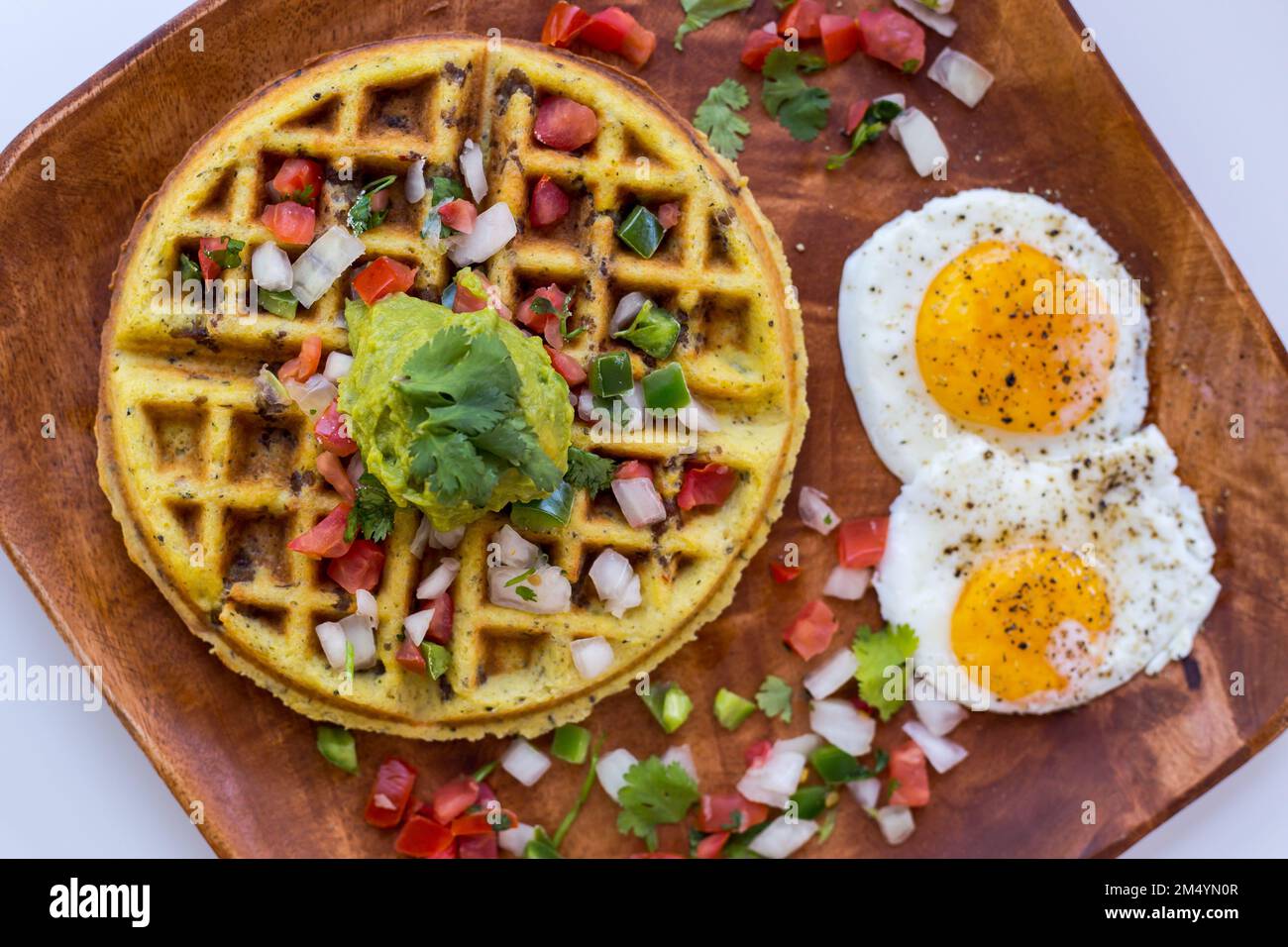 a high angle shot of a Dinner Waffle with veggies and eggs Stock Photo ...