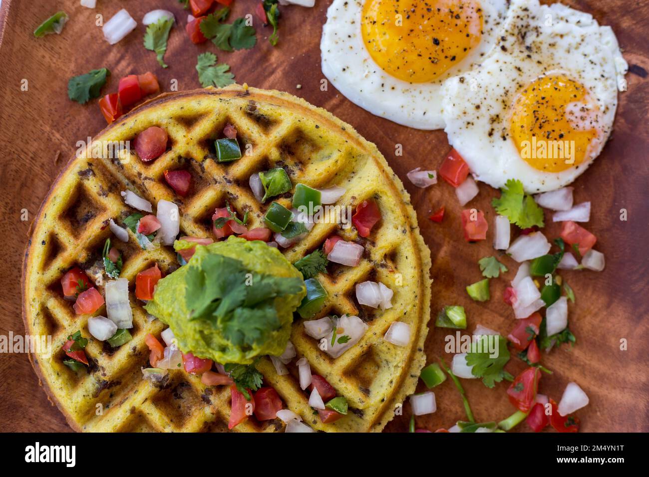 a High angle shot of a Dinner Waffle with veggies and eggs Stock Photo ...