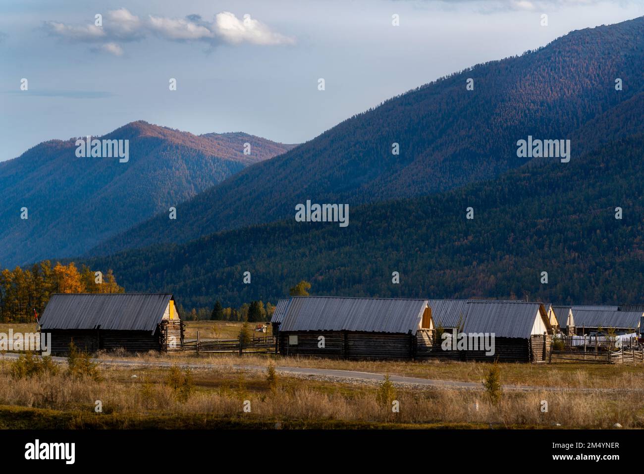 The rural buildings against the background of mountains. Xinjiang ...