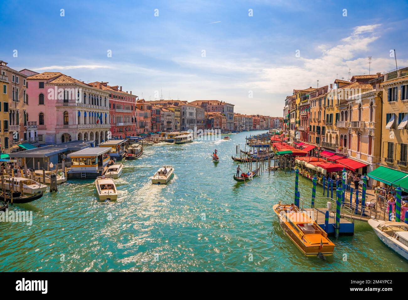 A beautiful view of boats and old houses from the top of Rialto bridge ...