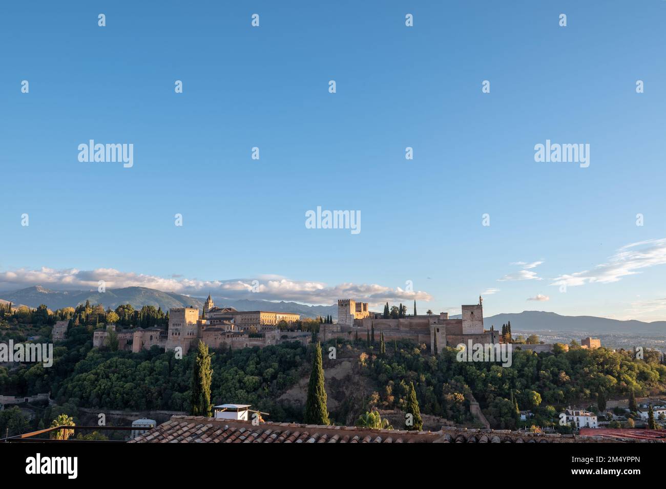 Aerial view of the Alhambra Palace in Granada, Spain with snow-capped ...
