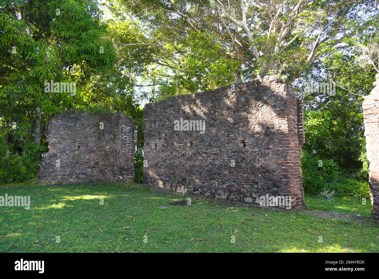 Beautiful ruined walls of an ancient building covered by the shadows of ...
