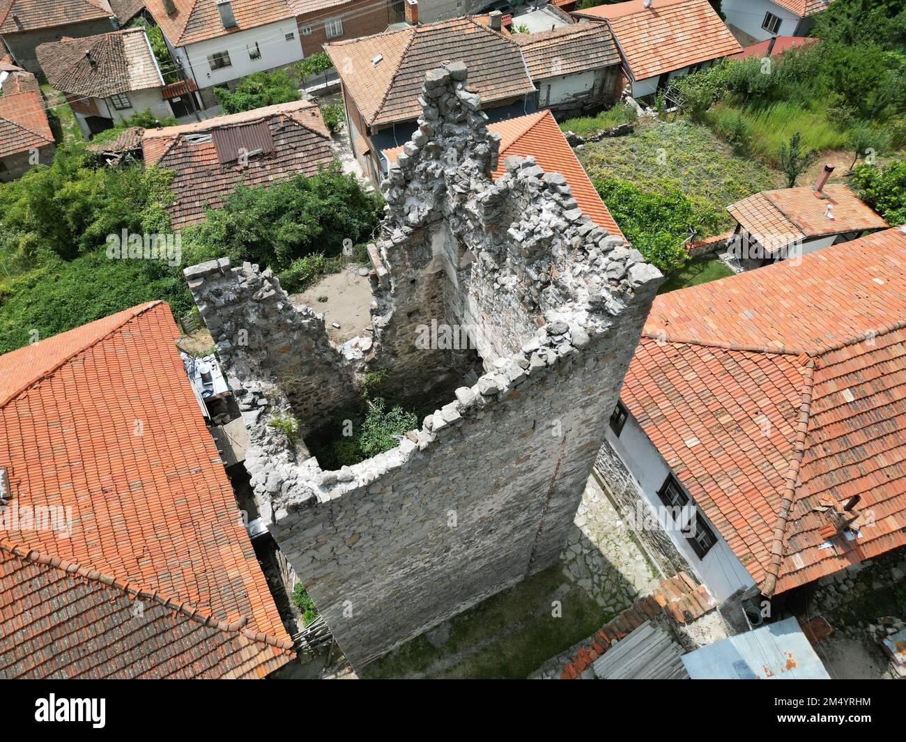 A bird's eye view of ancient ruins near residential buildings Stock ...
