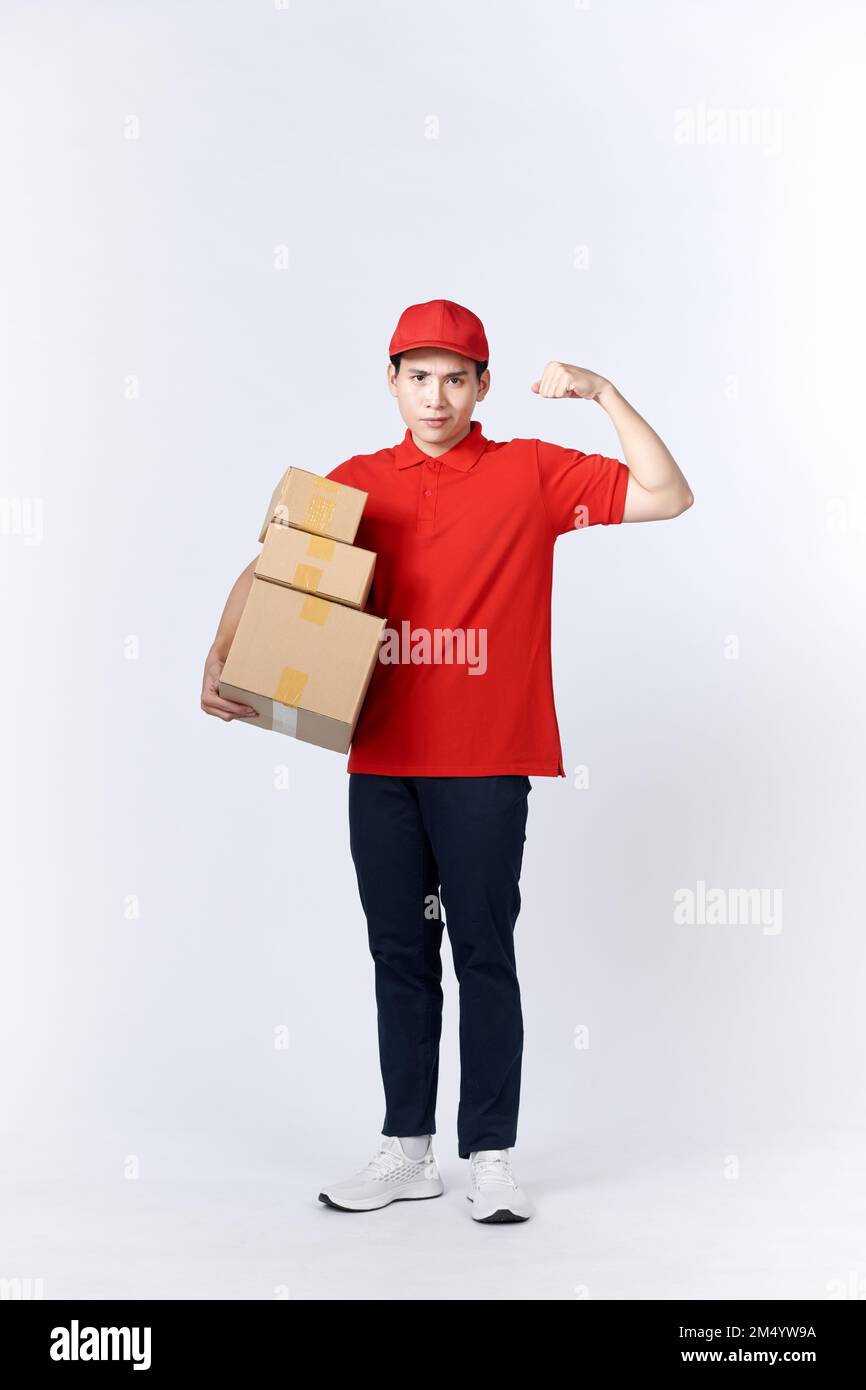 Professional delivery guy employee man in red cap T-shirt uniform ...
