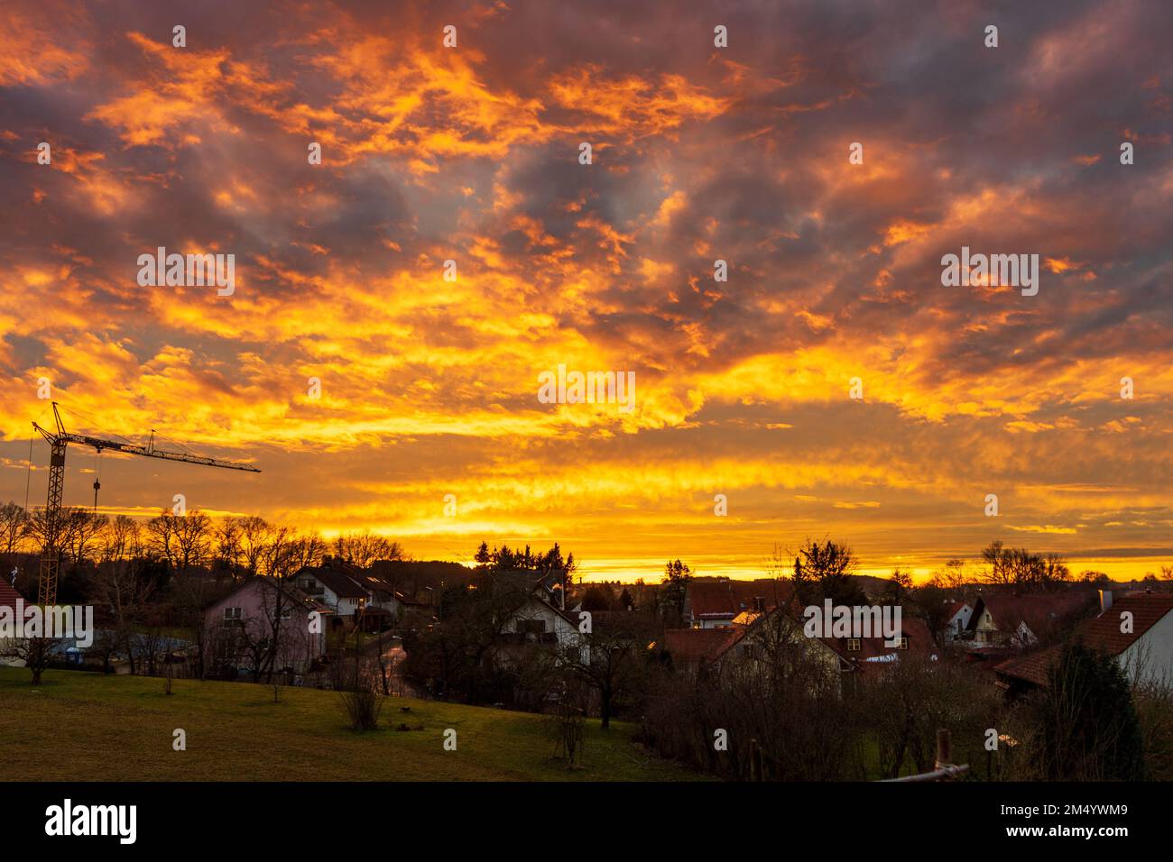 A beautiful bright sunset sky over a city in the evening Stock Photo ...
