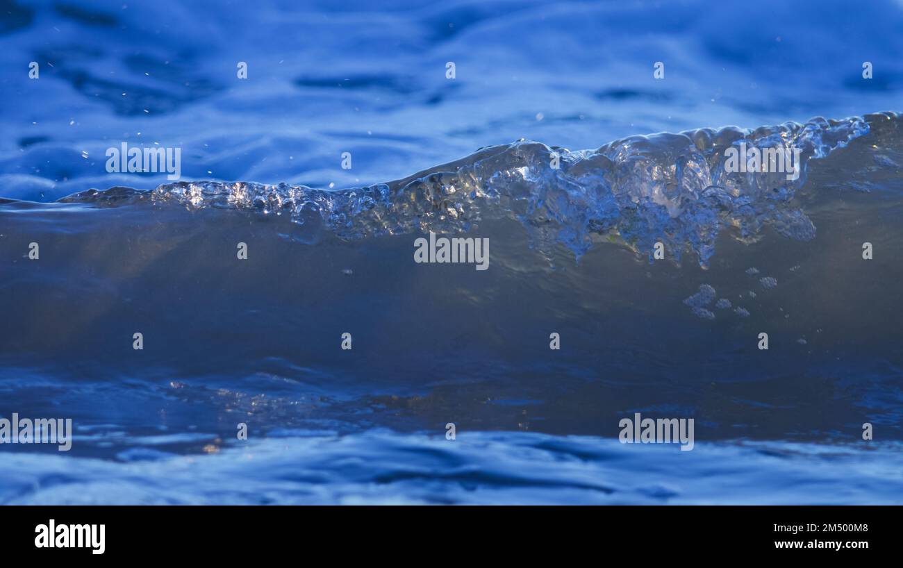 Ocean wave splashing Stock Photo - Alamy