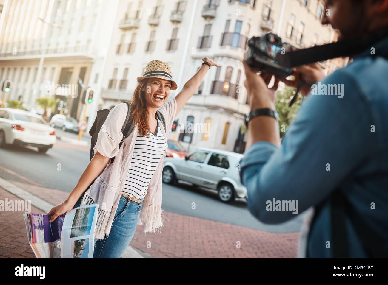 Shes having so much fun. a woman posing for a picture while out in a ...