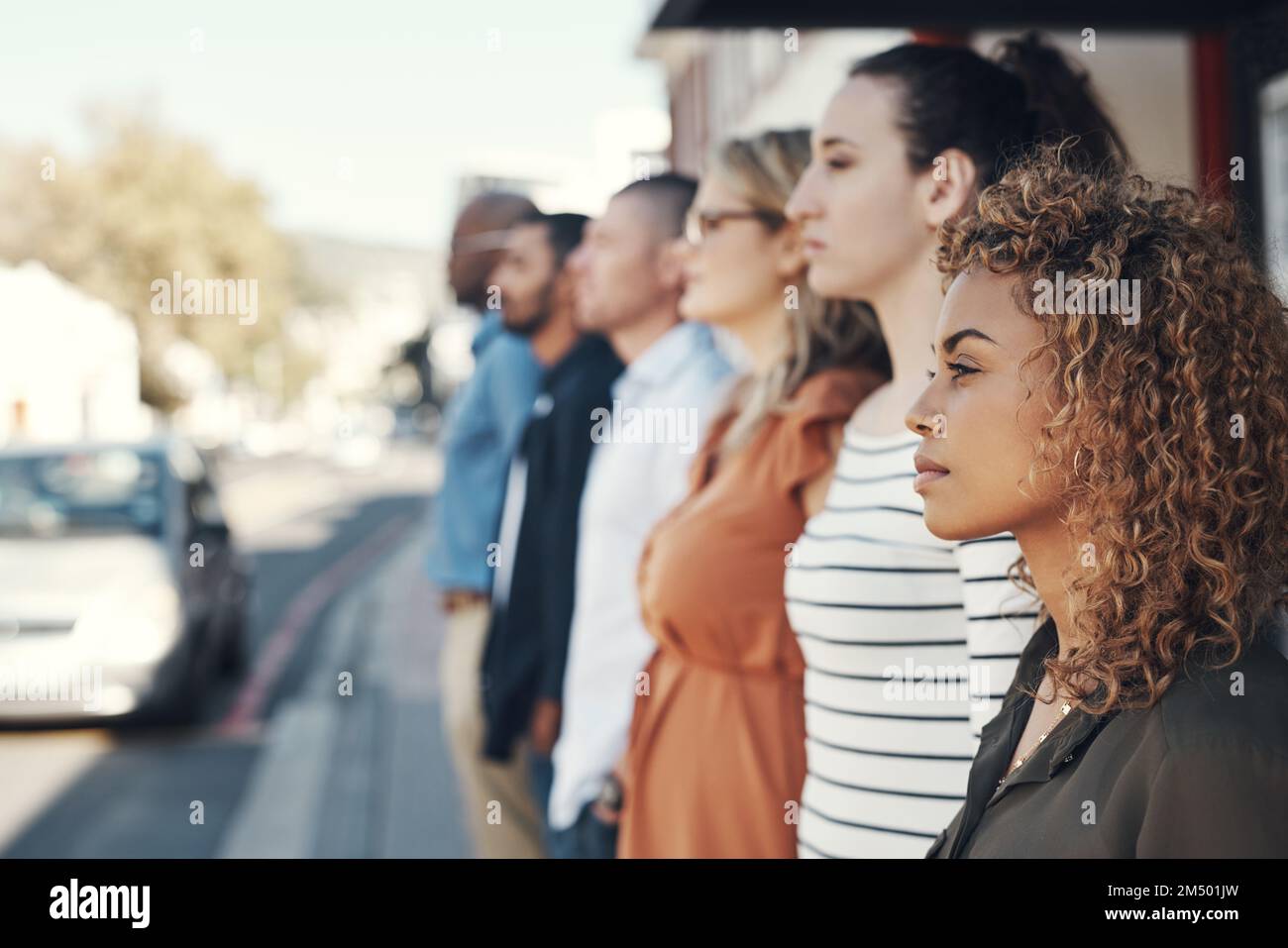 Lined up and ready to face the world. a group of people standing in a ...