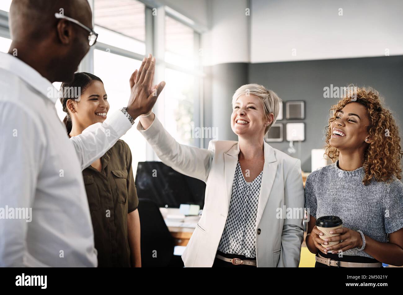 High fiving in modern hi-res stock photography and images - Alamy