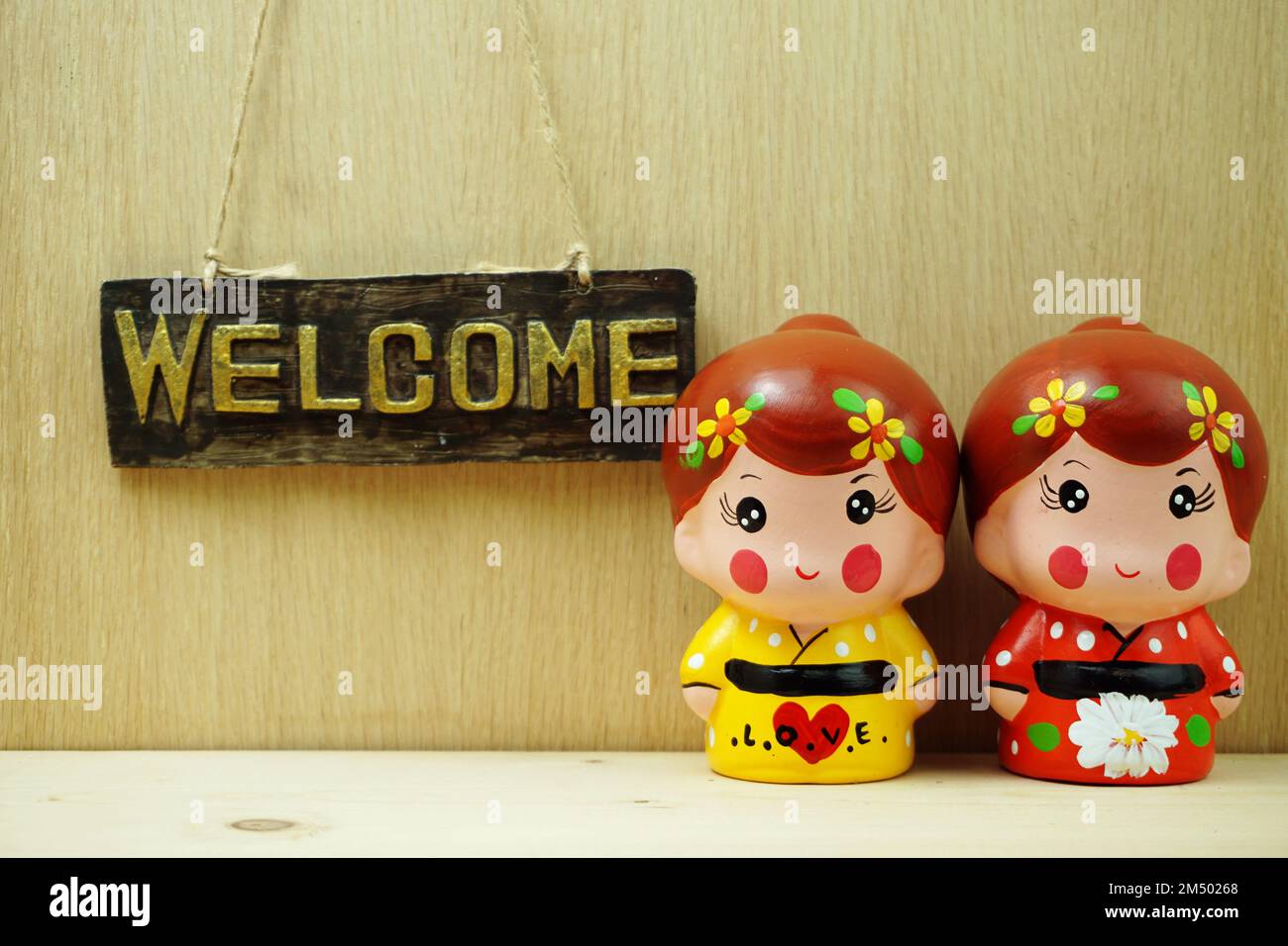 Welcome sign and Ceramic Japanese Girl Doll on wooden background Stock ...