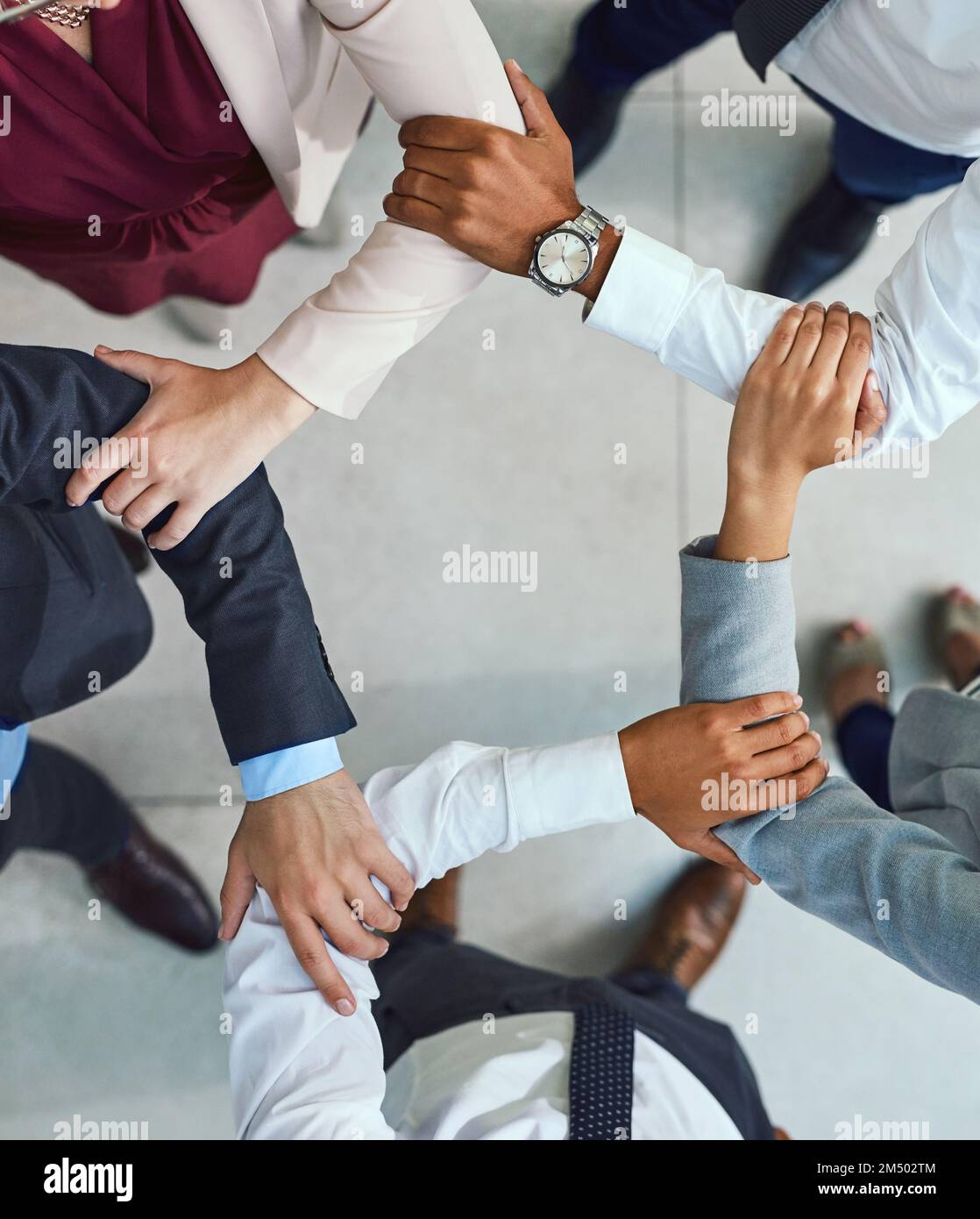 All-round trust and support. High angle shot of a group of ...
