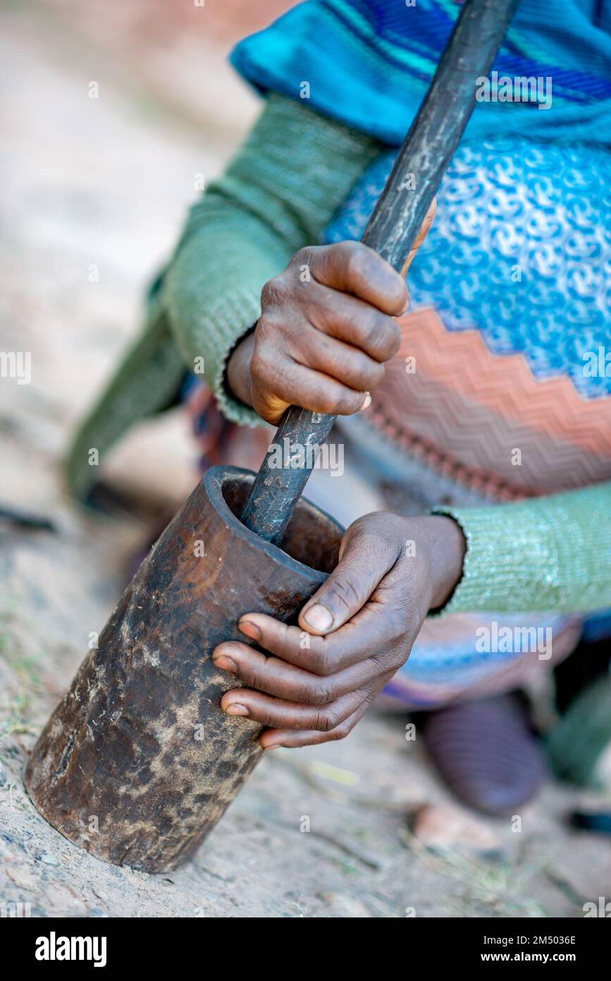 A vertical shot of coffee grinding process in Ethiopia Stock Photo - Alamy