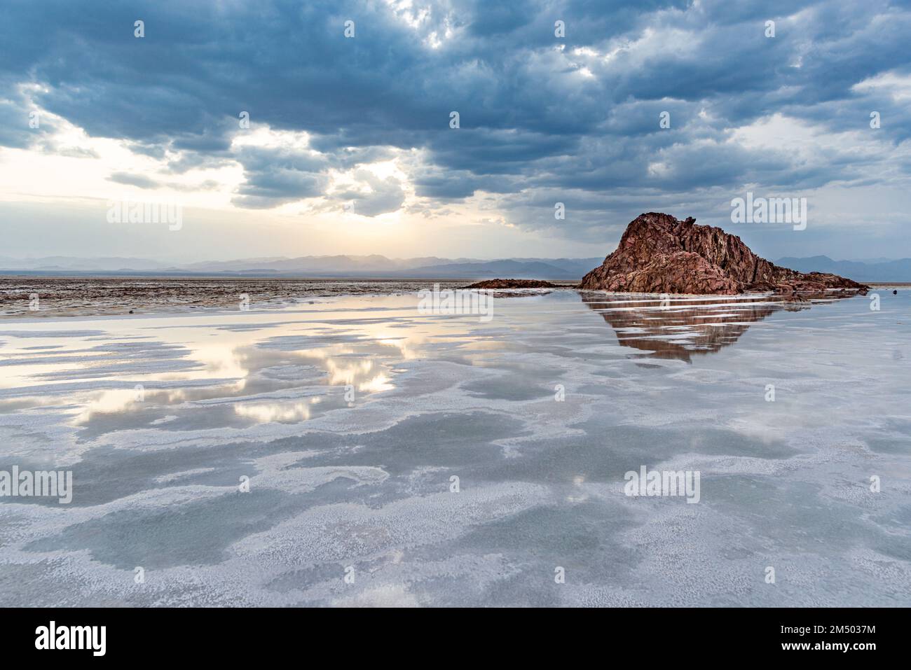 The salt flats formations under the cloudy sky of Ethiopia Stock Photo ...