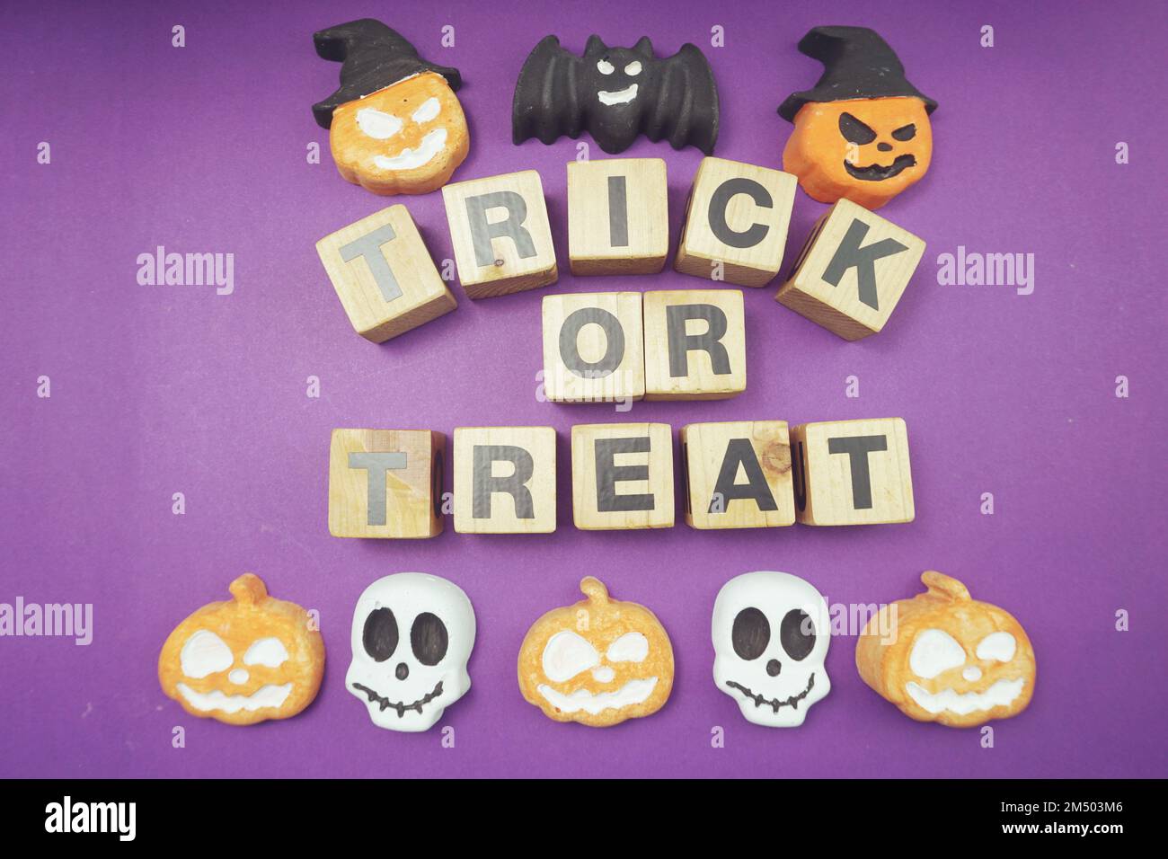 Halloween concept flat lay Trick or Treat alphabet letters on purple ...