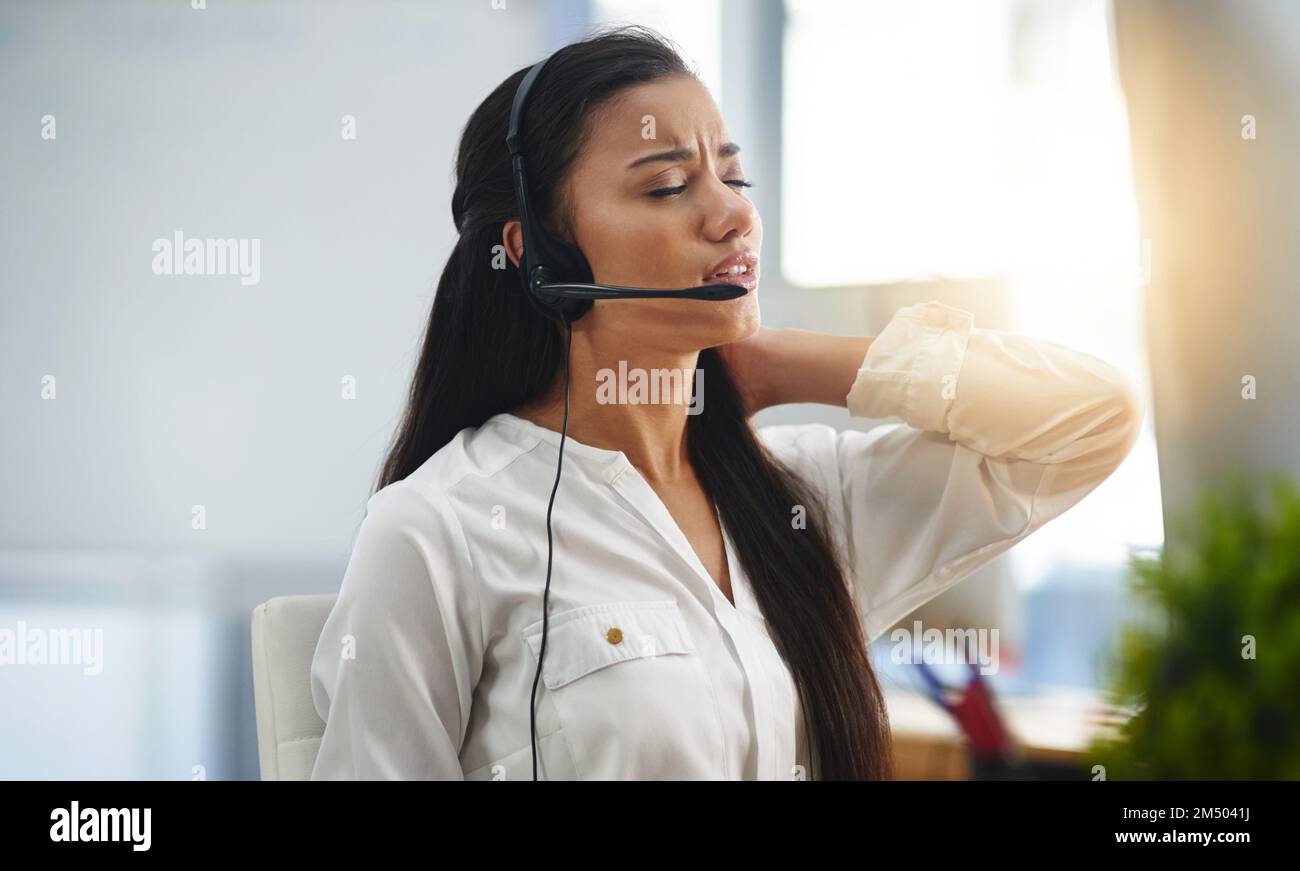 Hard days work can make any body ache. a female agent experiencing an ...