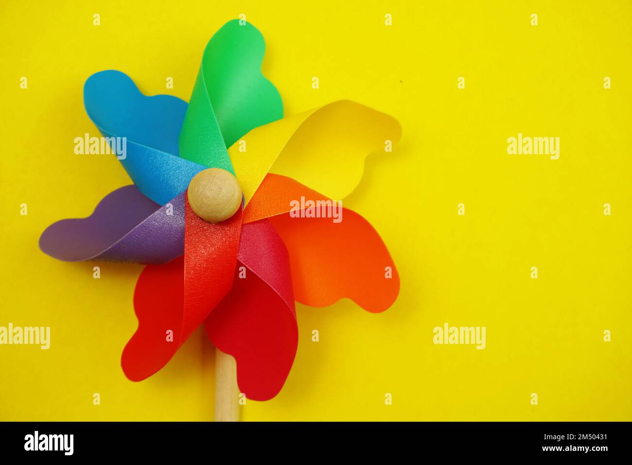 colorful pinwheel with space copy isolated on yellow background Stock ...