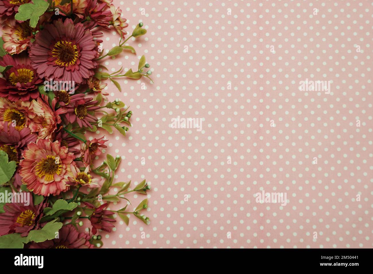 Flower border with pink polka dot background Stock Photo - Alamy