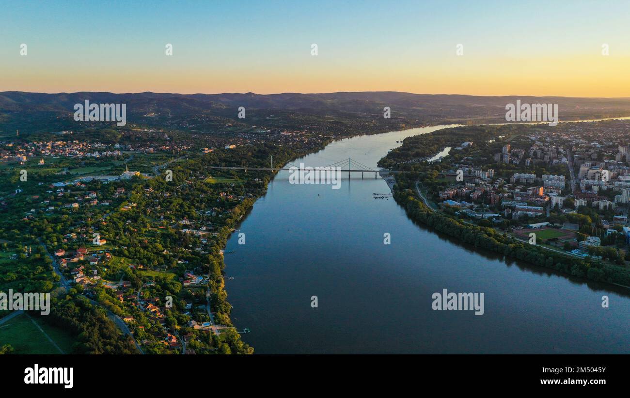 An aerial view of Novi Sad cityscape with river and Liberty bridge at sunset Stock Photo - Alamy