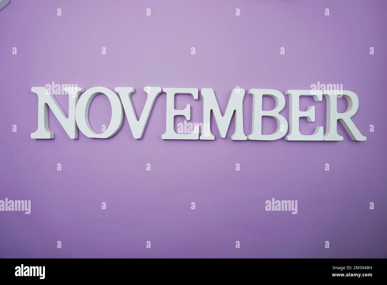 November alphabet letter with space copy on Purple background Stock ...