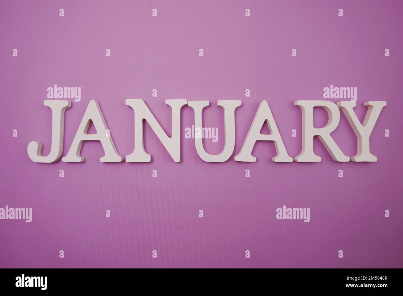 January alphabet letters on purple background Stock Photo - Alamy