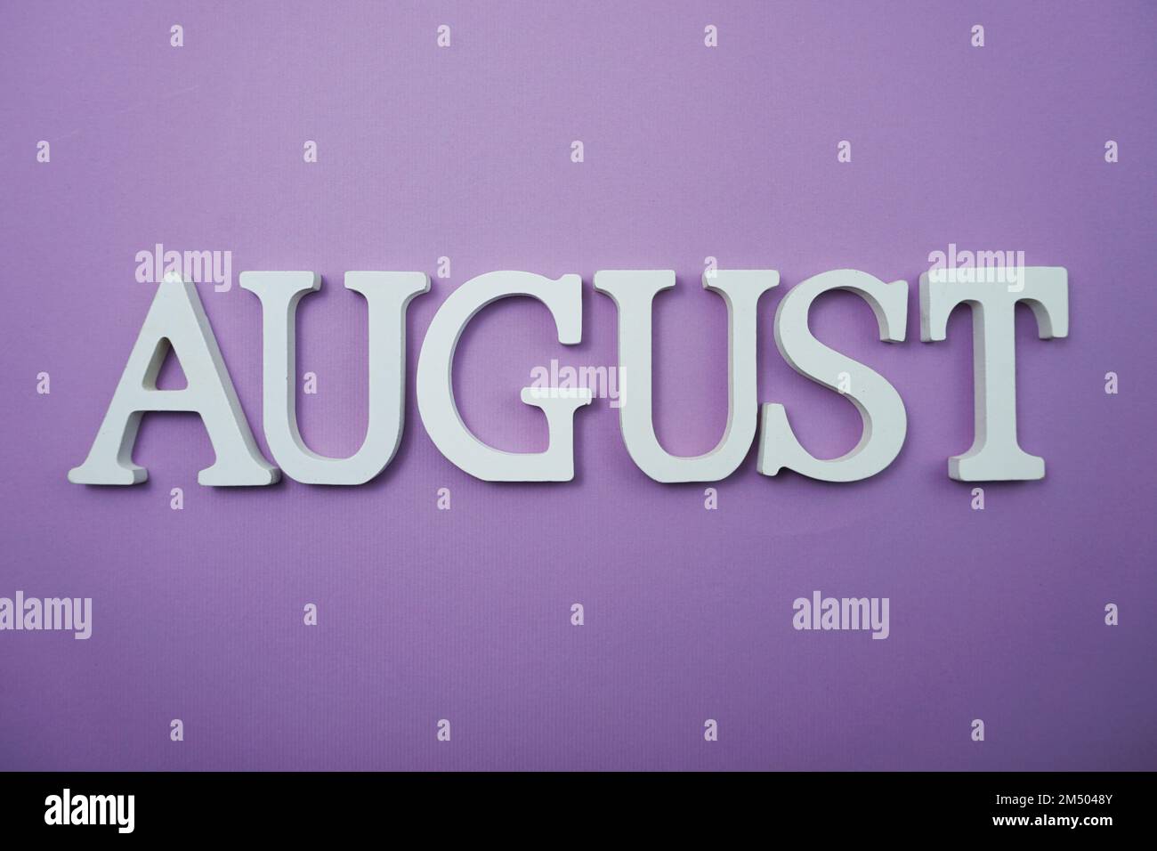 August alphabet letter with space copy on Purple background Stock Photo ...