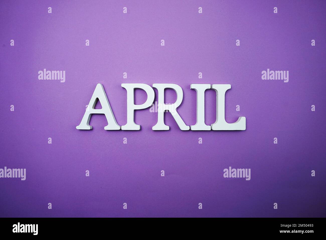 April alphabet letters on purple background Stock Photo - Alamy