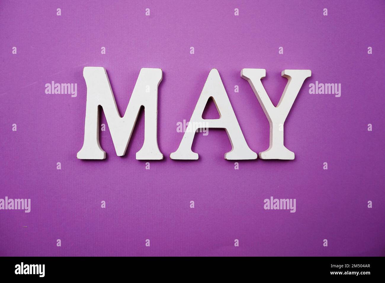 May alphabet letter with space copy on Purple background Stock Photo ...