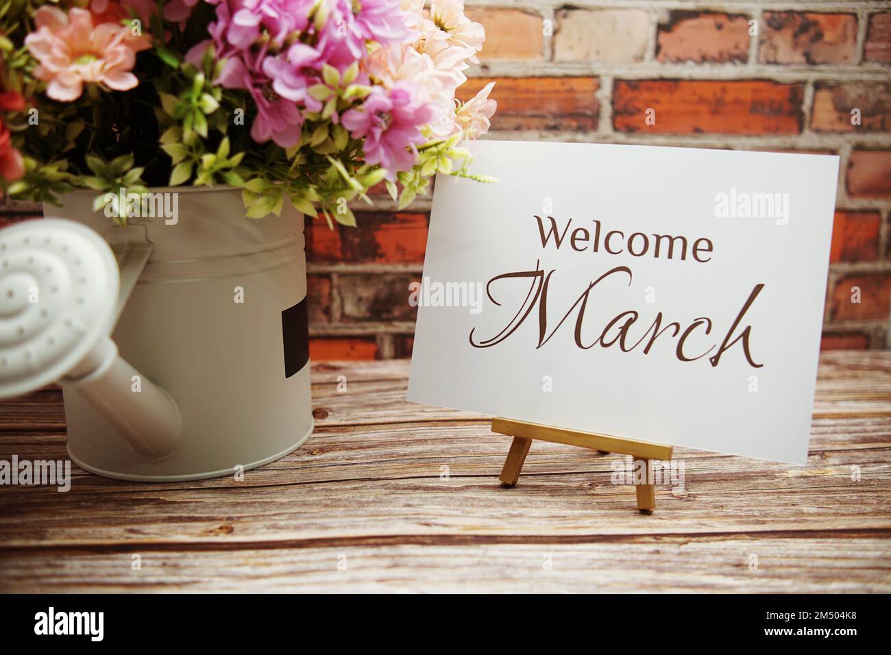 Welcome March text with flower bouquet decoration on wooden and old ...