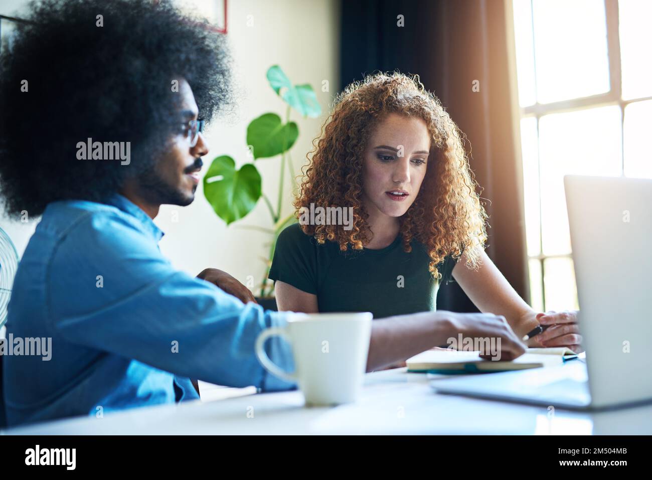 Deciding on their best designs. two young designers brainstorming ...