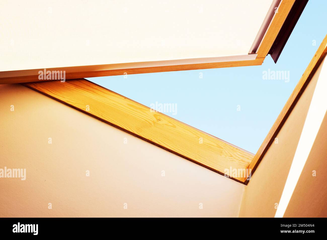 Open skylight with a piece of blue sky Stock Photo - Alamy