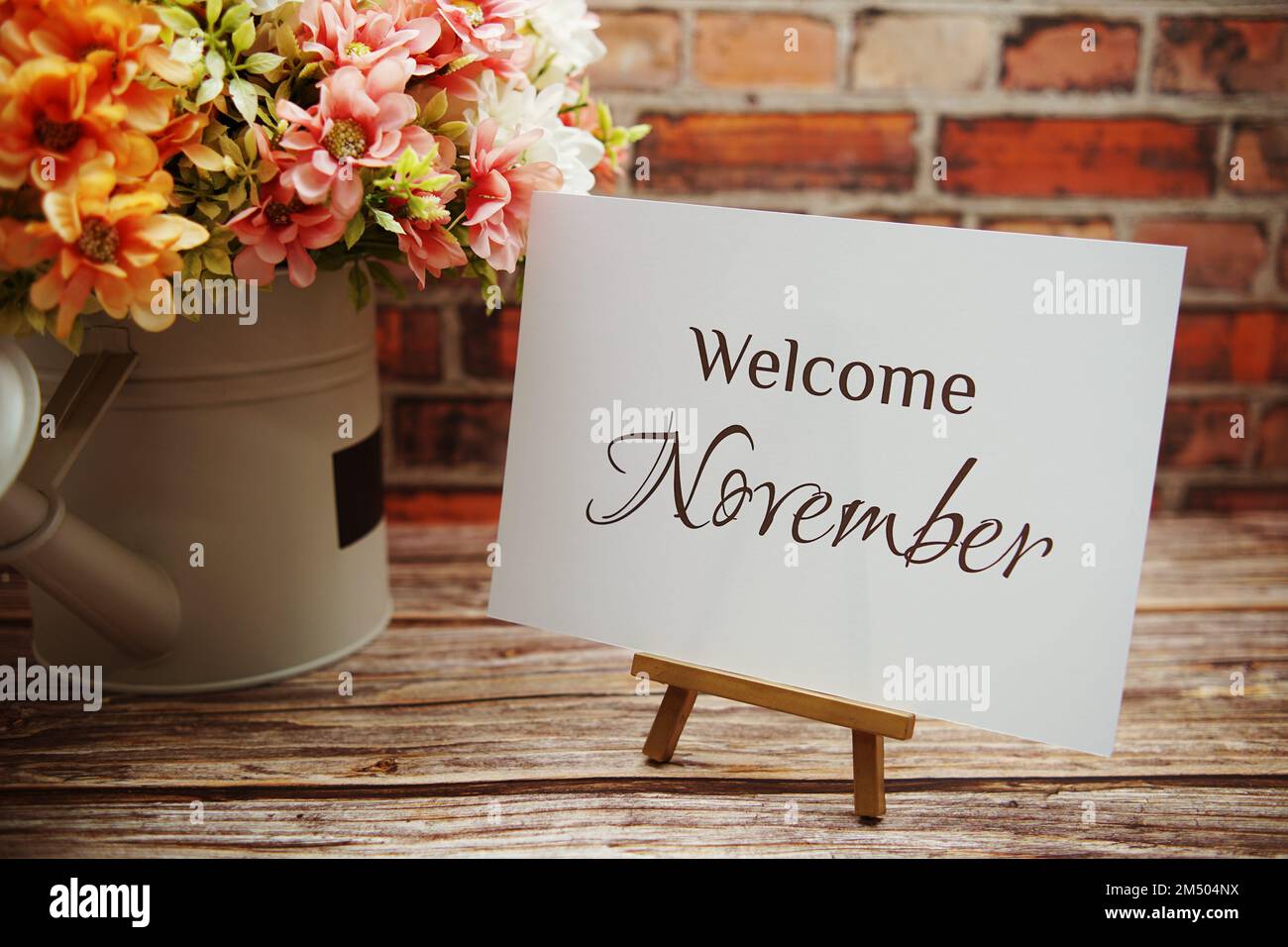 Welcome November text with flower bouquet decoration on wooden and old ...
