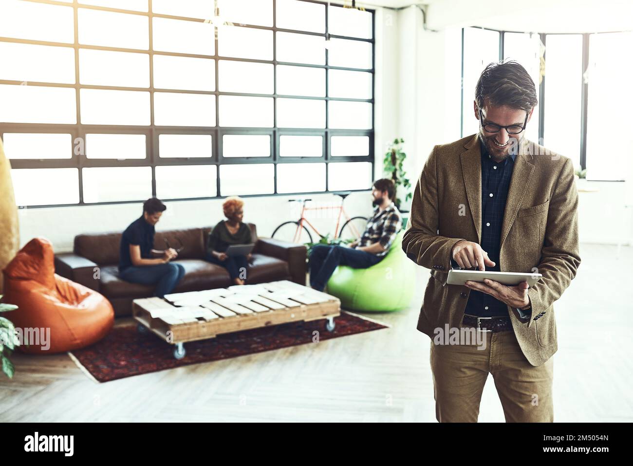 Anything is possible with a tablet at hand. a young designer using his ...