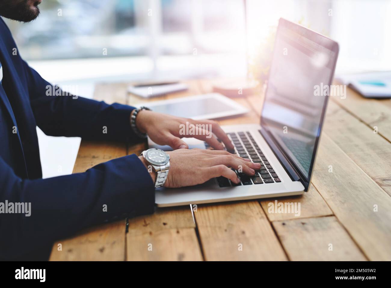 Up close and personal with productivity. a businessman using a laptop ...