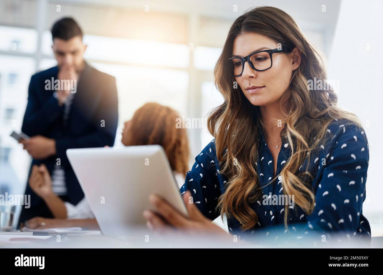 She works hard for her team. creative employees working in a modern ...