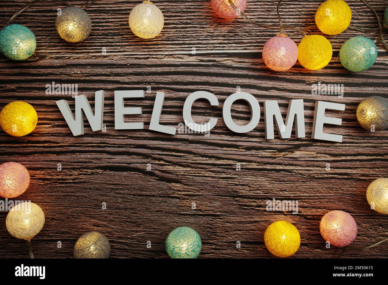 Welcome alphabet letters decorate with LED cotton balls on wooden ...